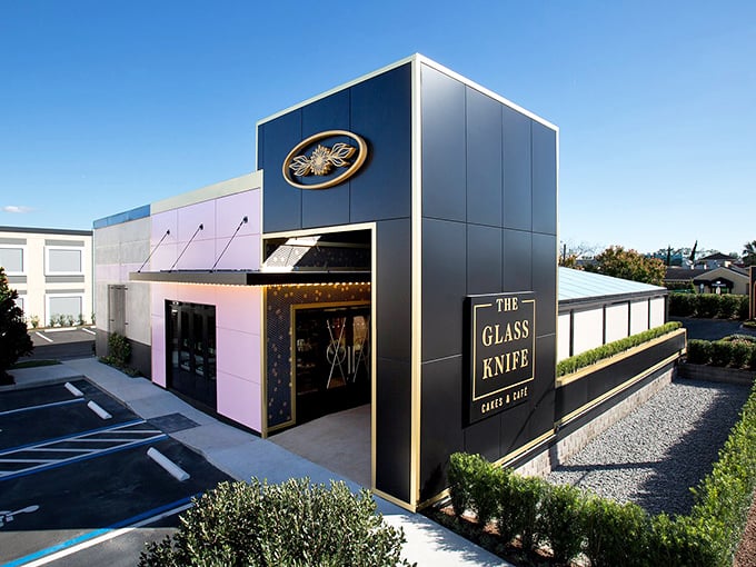 The Glass Knife's striking exterior blends modern architecture with a touch of whimsy&mdash;black panels meet that signature pink wall like formal wear accessorized with a playful pocket square.
