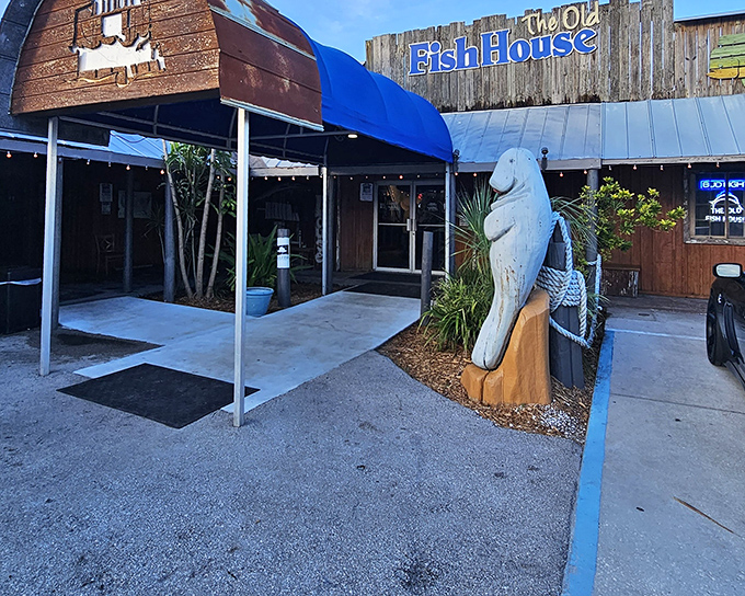 The weathered wooden exterior and manatee statue aren't trying to impress anyone&mdash;they're too busy guarding decades of authentic Florida flavor inside.