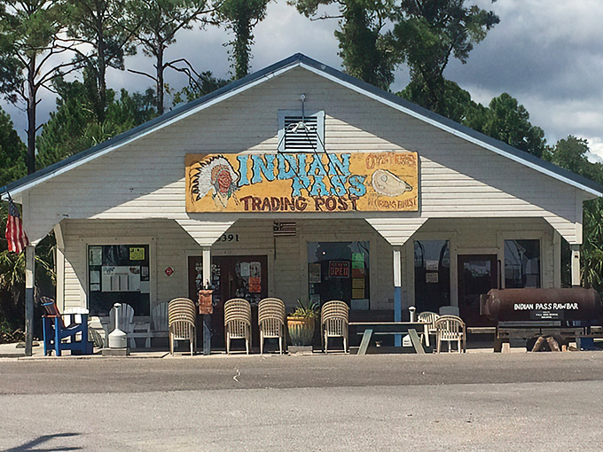 The unassuming exterior of Indian Pass Raw Bar, with its vibrant yellow sign and blue-trimmed porch, offers the first hint that you've found Florida's authentic seafood haven.