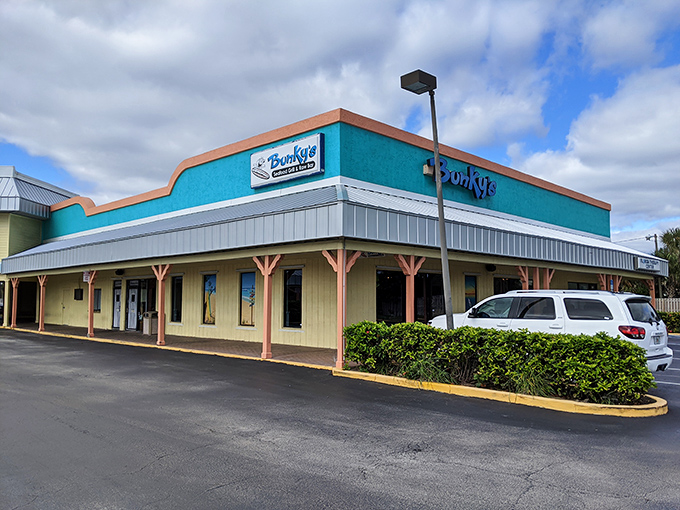 The turquoise beacon of Bunky's stands out like a culinary lighthouse, promising seafood treasures within its unassuming strip mall setting.
