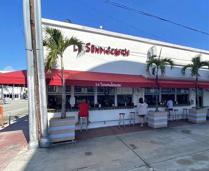 The unassuming storefront with its signature red awning proves that culinary greatness doesn't need flashy neon or velvet ropes&mdash;just perfect sandwiches and hungry customers.