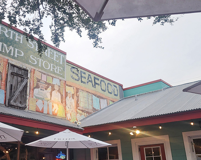 The colorful exterior of Fourth Street Shrimp Store welcomes you with vibrant murals and cherry-red picnic tables. Florida dining at its most authentically unpretentious.