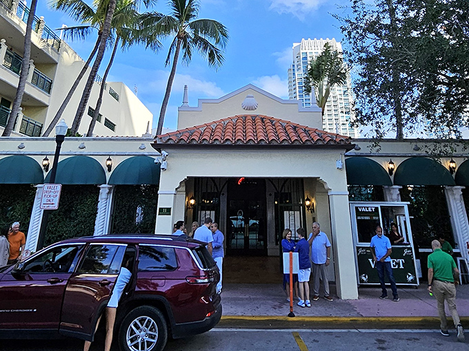 The cream-colored Mediterranean Revival building stands like a culinary lighthouse on Washington Avenue, promising seafood salvation to all who enter.
