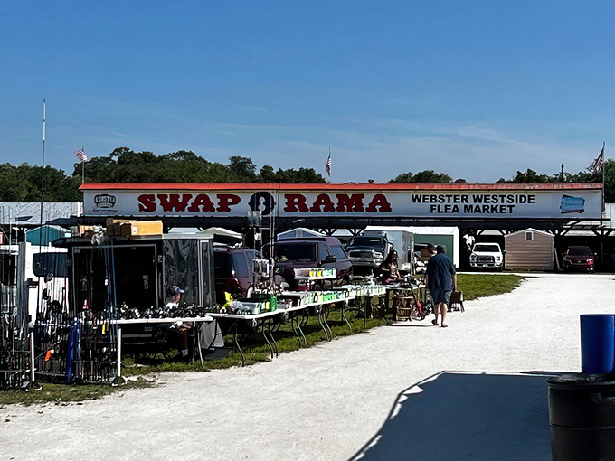 The iconic Swap-O-Rama sign welcomes treasure hunters under Florida's brilliant blue sky, promising adventures in bargain hunting beyond its gates.