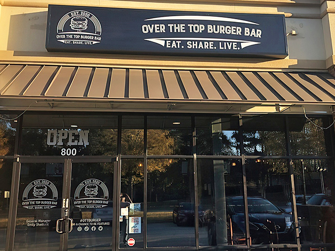 The blue signage beckons like a lighthouse for the hungry. "Eat. Share. Live." isn't just a motto&mdash;it's a survival strategy.