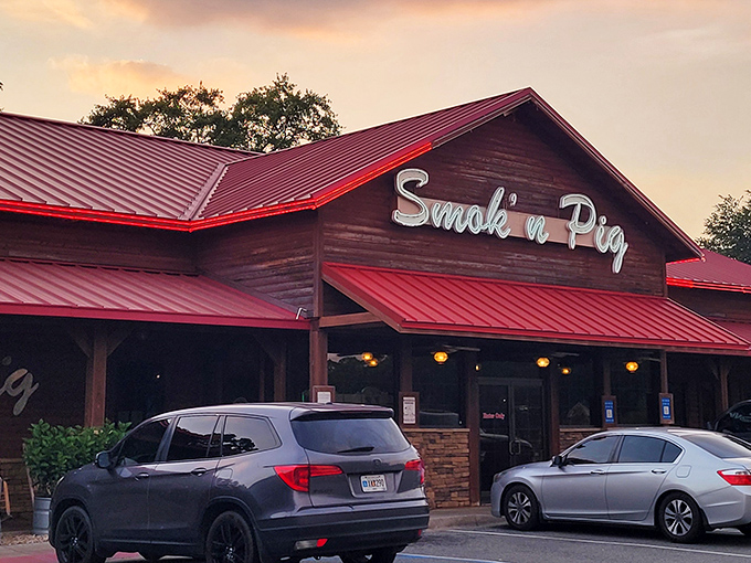 The rustic wooden exterior with its signature red roof stands like a BBQ beacon. Come hungry, leave happy&mdash;and possibly in need of elastic waistbands.