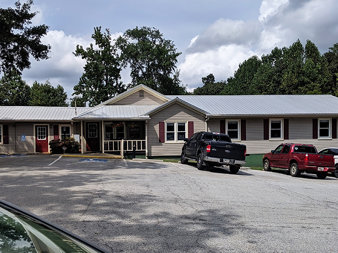 The unassuming entrance to Bar-H Barbecue proves once again that in the South, the most modest porches often hide the most magnificent flavors.