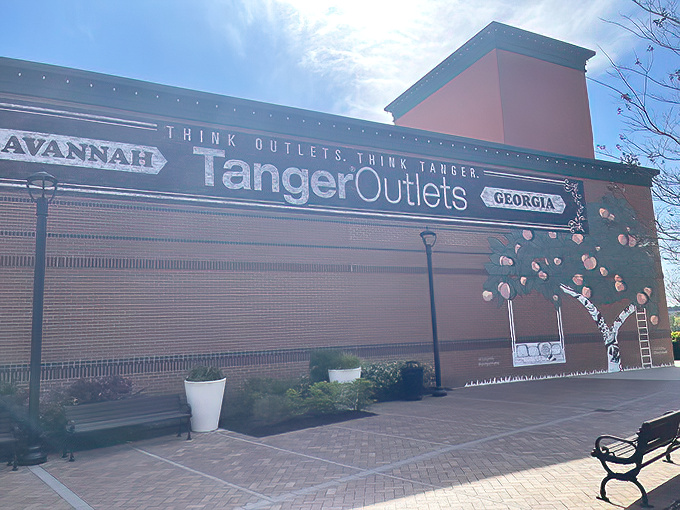 The grand entrance to Tanger Outlets Savannah welcomes shoppers with its distinctive signage, promising retail adventures that'll make your credit card both weep and rejoice.