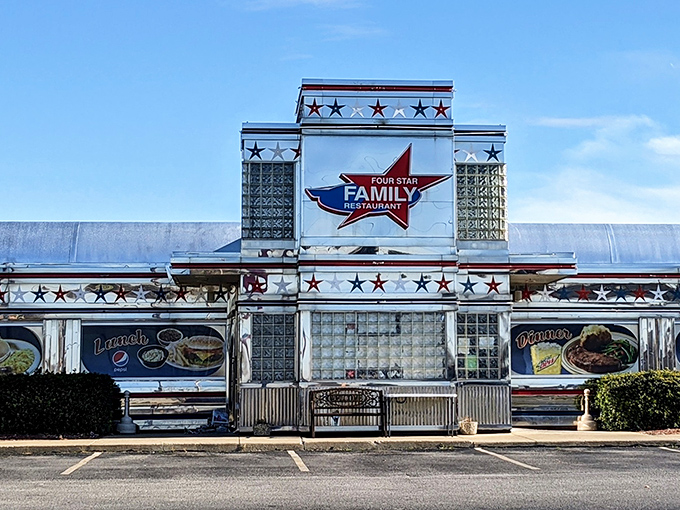 The iconic red, white, and blue sign beckons hungry travelers like a patriotic lighthouse guiding ships to the shore of breakfast bliss.
