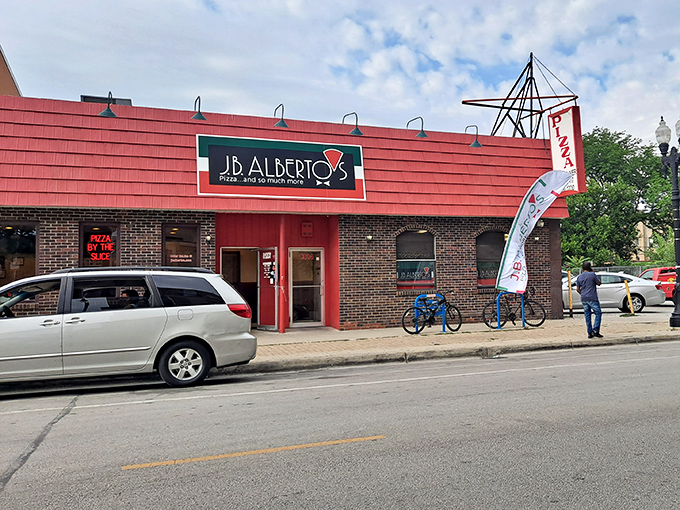The iconic red awning of J.B. Alberto's stands out on Sheridan Road like a beacon calling hungry Chicagoans home. Pizza salvation awaits inside.