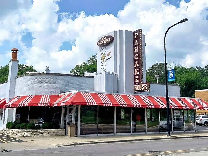 The iconic red and white awning of Walker Bros. beckons like a breakfast lighthouse guiding hungry souls to pancake paradise.