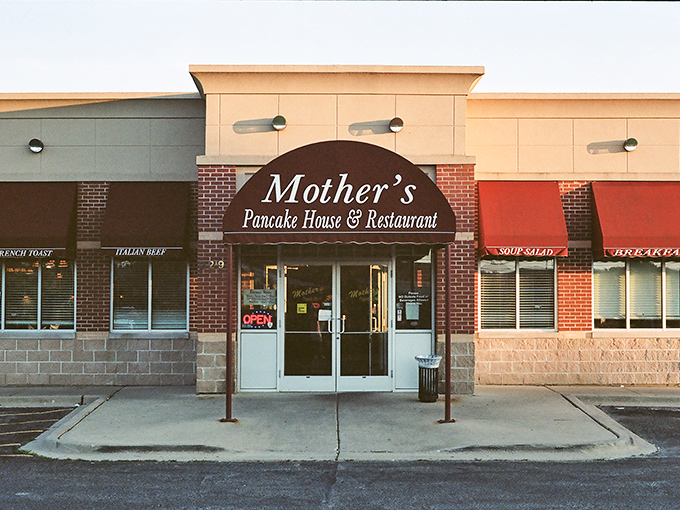 The unassuming storefront of Mother's Pancake House beckons like a breakfast lighthouse in Aurora's strip mall sea. Comfort awaits inside.