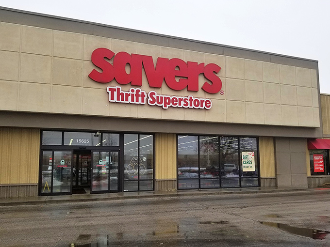 The bold red Savers sign beckons like a lighthouse for bargain hunters navigating the sea of retail sameness.