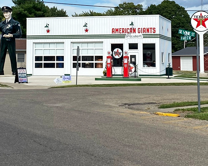 The gleaming white exterior of American Giants Museum beckons Route 66 travelers with vintage Texaco pumps standing guard like red sentinels of a bygone era.