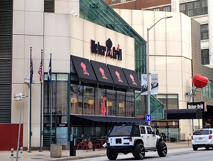 The iconic Weber Grill Restaurant stands proudly in downtown Indianapolis, its distinctive awnings featuring the silhouette of their famous kettle grills.