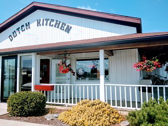 The unassuming white exterior of Dutch Village Restaurant stands like a beacon of breakfast hope in Nappanee, promising homestyle delights without any fancy pretensions.