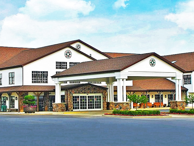 The iconic yellow exterior of Das Dutchman Essenhaus stands like a beacon of comfort food in Middlebury, promising Amish cooking that'll make your cardiologist weep and your soul sing.