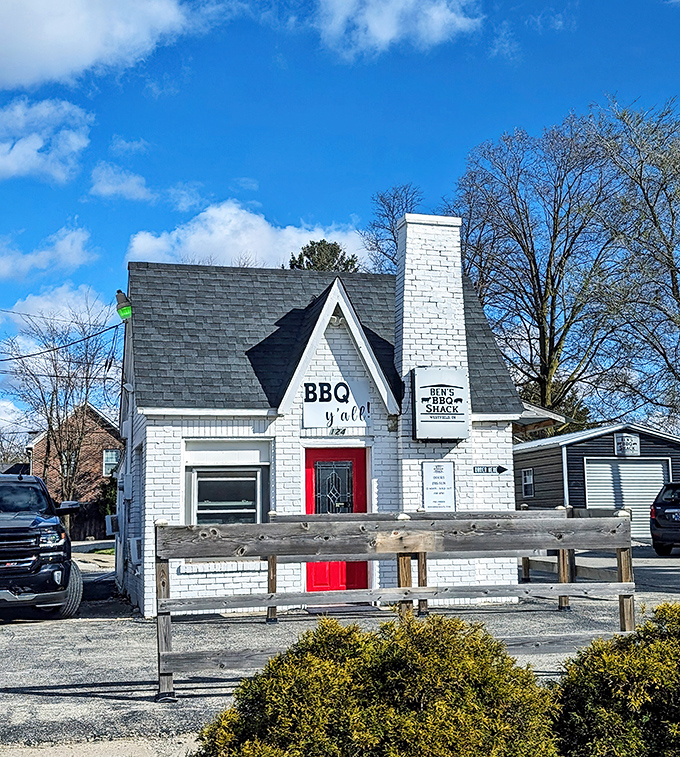 The little white house with the red door isn't a fairy tale cottage&mdash;it's something better: a temple of smoke where BBQ dreams come true.