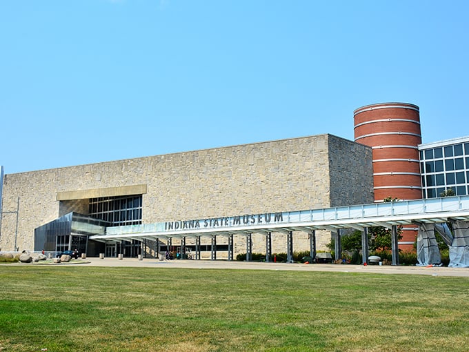 The limestone fa&ccedil;ade of the Indiana State Museum stands proudly against a blue sky, its modern design blending seamlessly with Indiana's geological heritage.