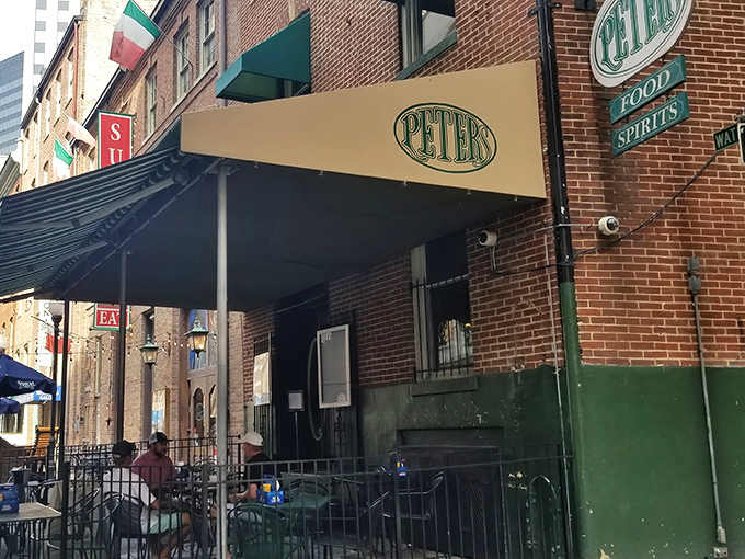 The unassuming brick facade of Peter's Pour House stands like a culinary speakeasy, promising treasures for those in the know.
