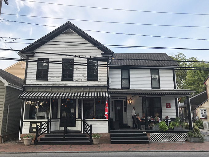 Classic Eastern Shore charm in white clapboard. Theo's unassuming exterior hides culinary treasures within, like finding a pearl in Chesapeake Bay.