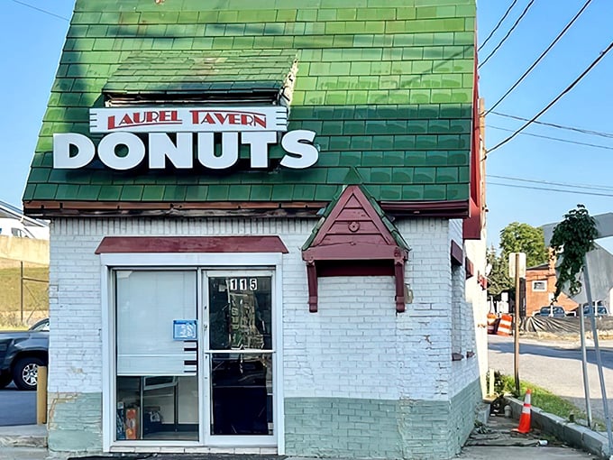 The iconic green-shingled roof and weathered "DONUTS HAMBURGERS" sign announce this Laurel institution without fanfare&mdash;architectural honesty at its most delicious.