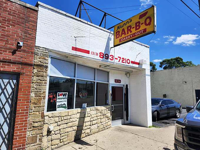 The bright yellow sign beckons like a culinary lighthouse in Detroit. This is where BBQ dreams and fried shrimp fantasies come true.