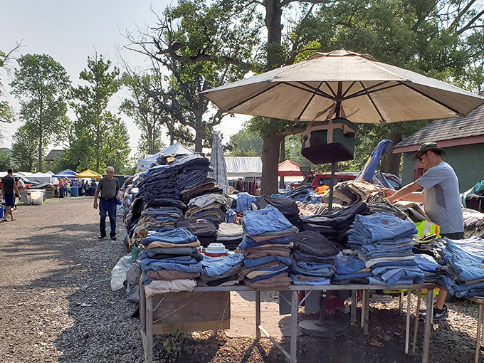 The iconic red barn serves as command central for treasure hunters, with tables of potential finds sprawling outward like a secondhand solar system.
