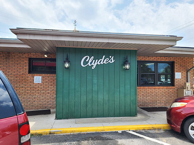 The green facade and classic script welcome you like an old friend. This unassuming entrance hides a treasure trove of Southern comfort.