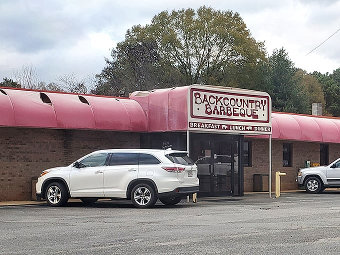 That pink awning isn't just a roof – it's a beacon of barbecue hope on Old Linwood Road, guiding hungry pilgrims to smoky salvation.