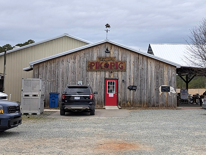 The weathered wooden exterior with that iconic red door isn't just inviting&mdash;it's practically whispering "get in here and eat something amazing."
