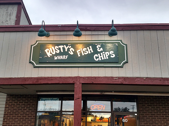The unassuming storefront of Rusty's Wharf beckons with its no-frills charm and glowing "OPEN" sign&mdash;proof that seafood treasures often hide in plain sight.