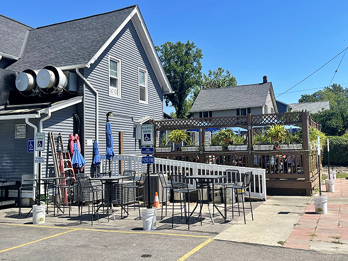 Home sweet lakeside home! Jake's On Lake's charming blue exterior with American flags fluttering in the breeze promises comfort food that's anything but ordinary.