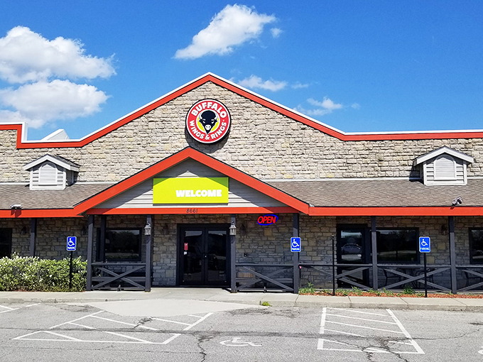 The stone facade of Wings and Rings in Lewis Center stands like a culinary fortress, promising delicious treasures within its welcoming walls.