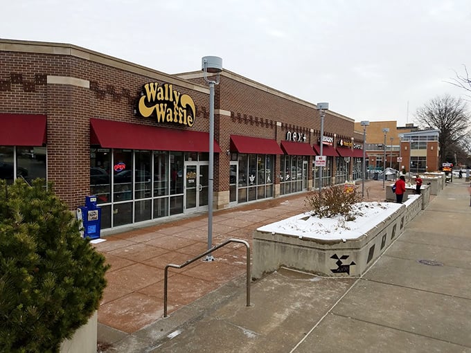The bright yellow Wally Waffle sign beckons like a breakfast lighthouse, promising carb-laden salvation to hungry Akronites.