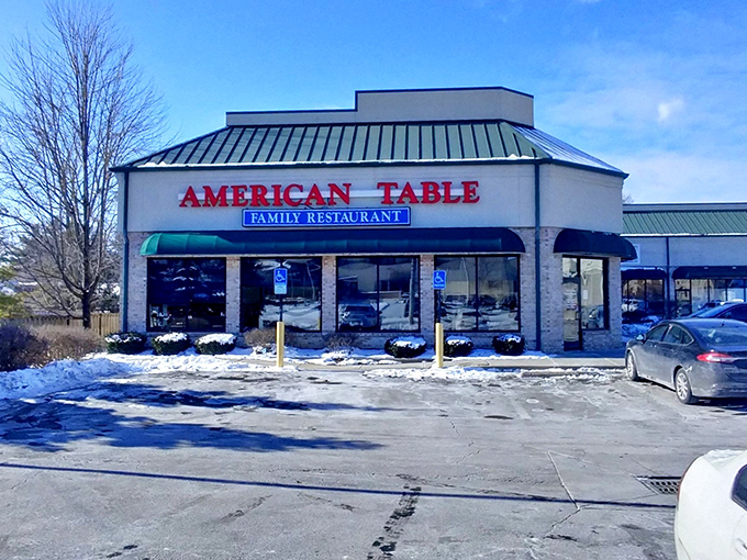 The beacon of breakfast bliss with its unmistakable green awnings and bright red signage announces itself to hungry travelers like a culinary lighthouse.