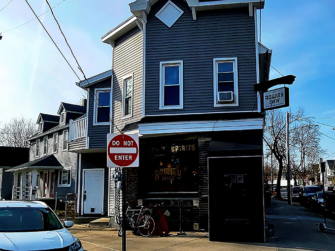 The unassuming exterior of The Rowley Inn stands like Cleveland's best-kept secret, a blue-gray beacon of culinary delight in Tremont's historic landscape.