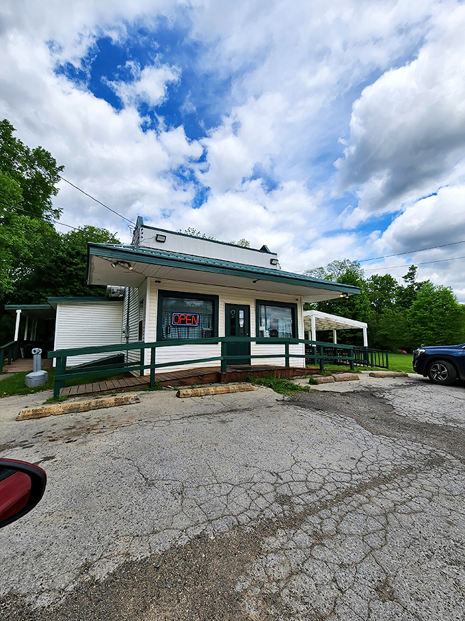 The humble white exterior with teal trim might not scream "culinary destination," but locals know this unassuming building houses flavor treasures worth the drive.