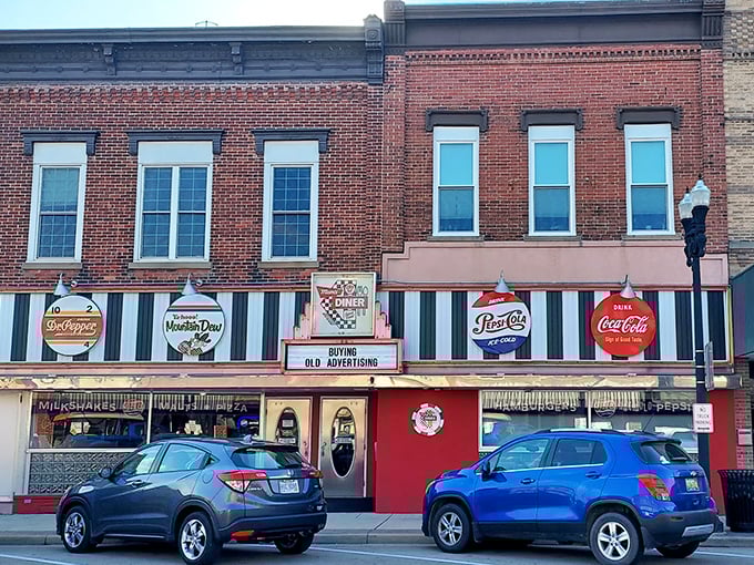 The classic red storefront of Mom's Diner & Pizzeria stands as a beacon of nostalgia on Archbold's main street, complete with vintage Pepsi-Cola and Mountain Dew signage that whispers, "Slow down and stay awhile." 