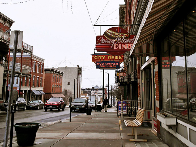 The iconic red Coney Island Diner sign stands as a beacon of comfort food on Mansfield's historic Main Street, promising nostalgic flavors and hometown hospitality.