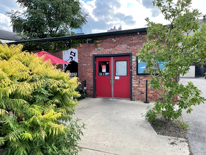 The unassuming brick exterior of Pierogi Mountain beckons with vibrant red umbrellas and a promise of Eastern European comfort food paradise.