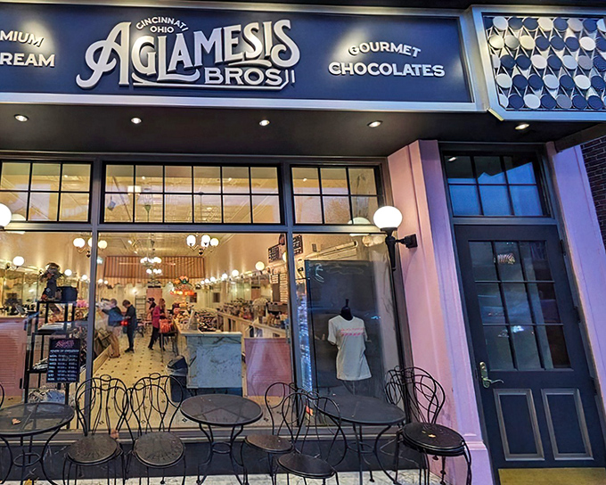The iconic blue Aglamesis Bros storefront beckons like a portal to a sweeter era, promising ice cream dreams and chocolate fantasies behind those welcoming doors.