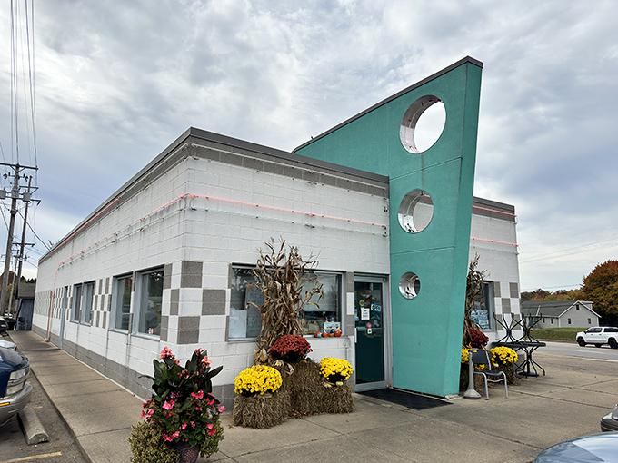 That iconic turquoise fin jutting skyward isn't just architectural flair&mdash;it's a beacon calling hungry travelers to a genuine slice of Americana in Alliance.