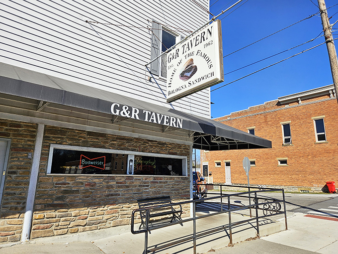The unassuming exterior of G&R Tavern stands proudly in Waldo, Ohio, where the sign boldly proclaims what pilgrims travel miles to taste: the famous bologna sandwich.