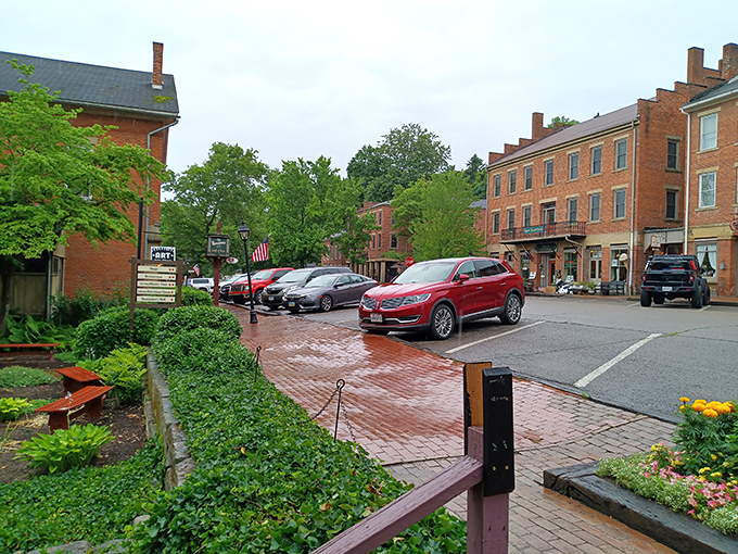 Modern cars parked along historic brick streets create a delightful time-traveling paradox in downtown Roscoe Village.
