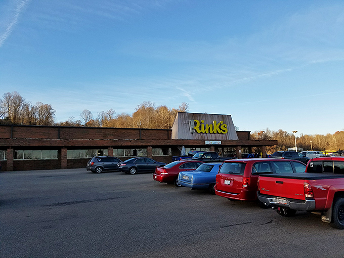 The unassuming exterior of Rinks belies the wonderland within. Like finding a treasure map in your attic, this humble storefront promises adventures your credit card never saw coming.