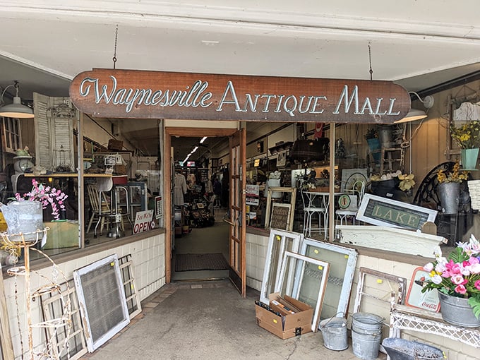 The unassuming entrance belies the wonderland within. Like a time portal disguised as a storefront, Waynesville Antique Mall beckons treasure hunters with promises of discovery.