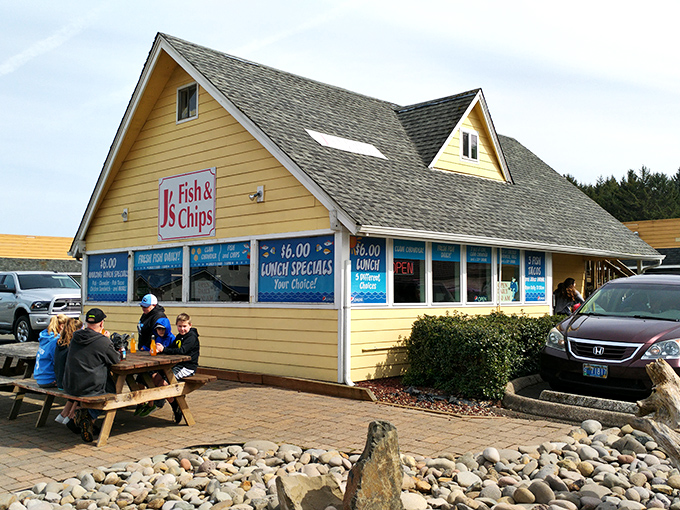 The bright yellow beacon of J's Fish & Chips stands out against the Oregon sky, promising seafood salvation to hungry coastal travelers.