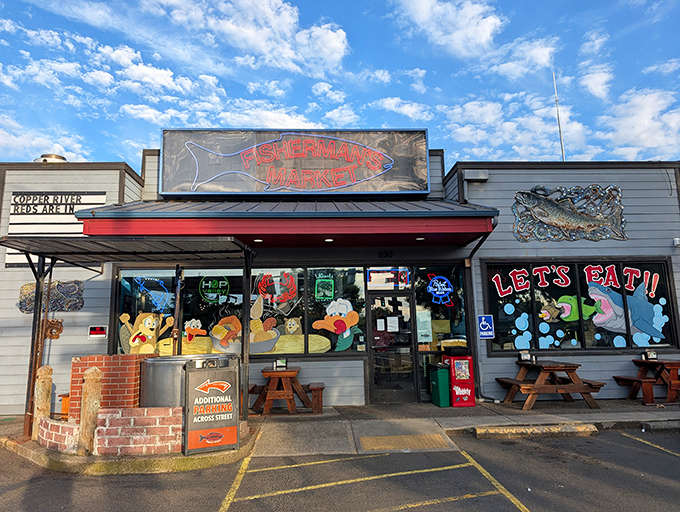 The neon glow of Fisherman's Market beckons like a lighthouse for hungry souls. Those picnic tables outside aren't just seating&mdash;they're stages for impending seafood euphoria.