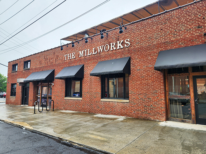 The sturdy brick exterior of The Millworks stands as Harrisburg's culinary fortress, where the "ART-FOOD-BREWERY" promise beckons hungry explorers inside.